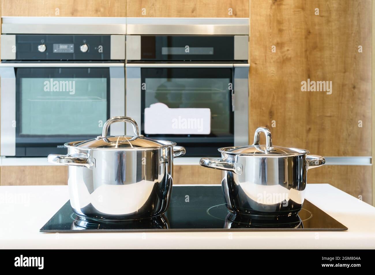 Metal Pot on induction hob in modern kitchen. modern kitchen pot ...