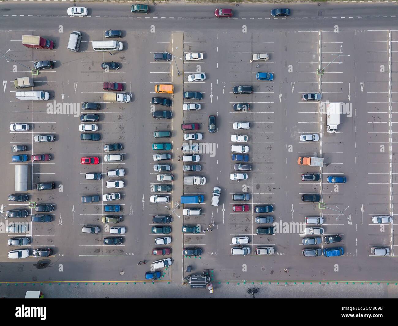 Drone view of a large car parking lot on a sunny summer day, horizontal ...