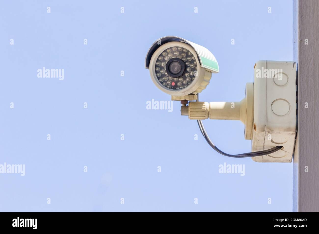Security CCTV camera or surveillance system in office building on blue ...