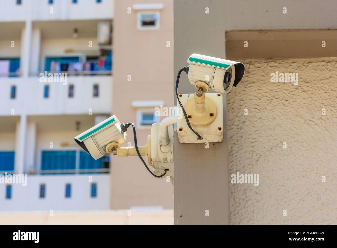 Security CCTV camera or surveillance system in office building on blue ...