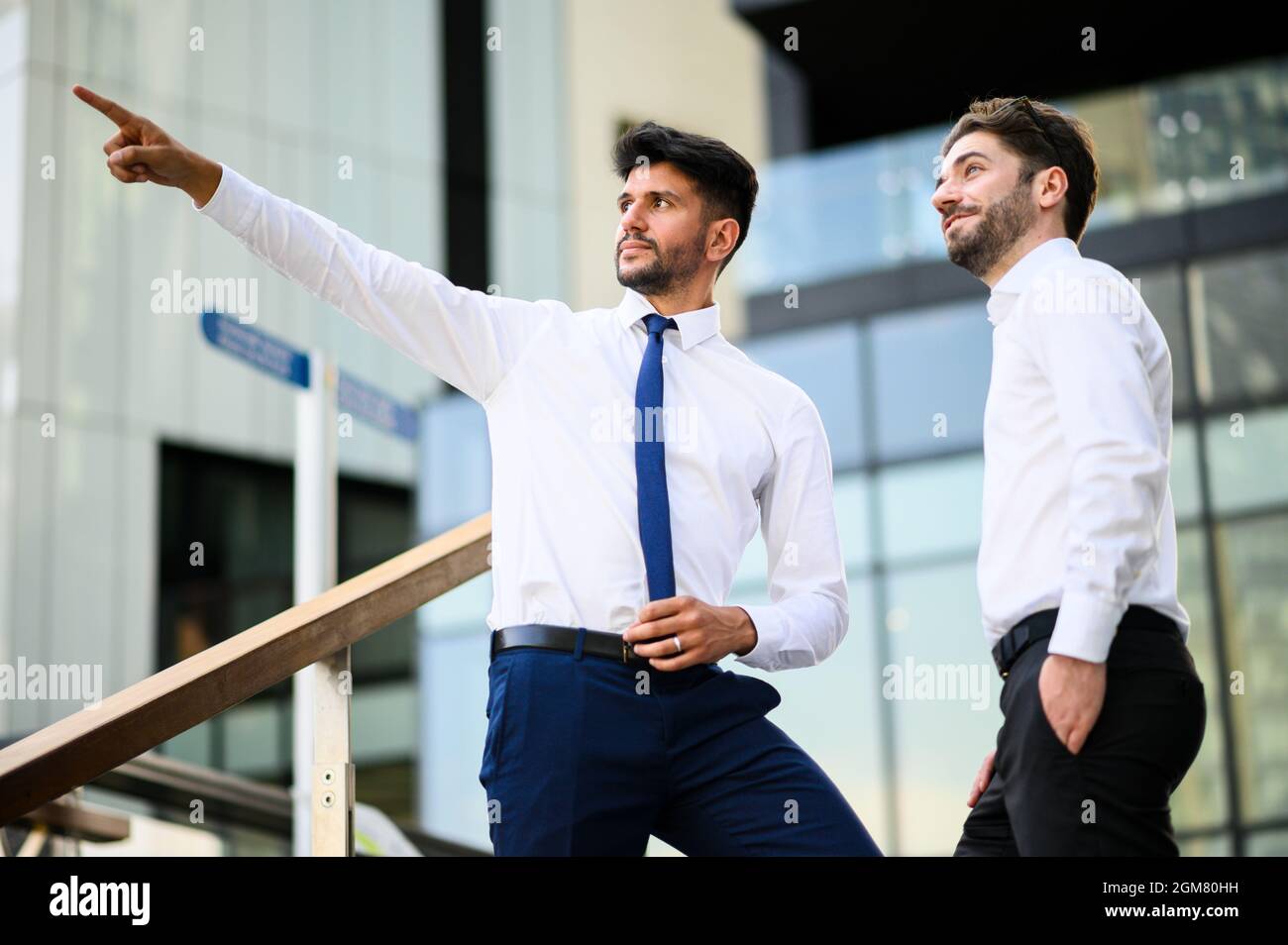 Business partners discussing together outdoor Stock Photo - Alamy