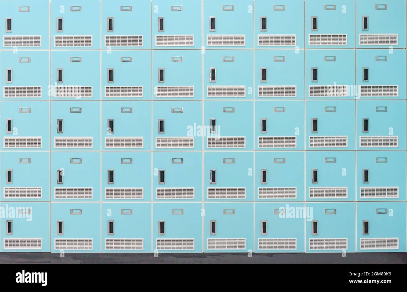 A front on view of a stack of Spring green metal school lockers with ...