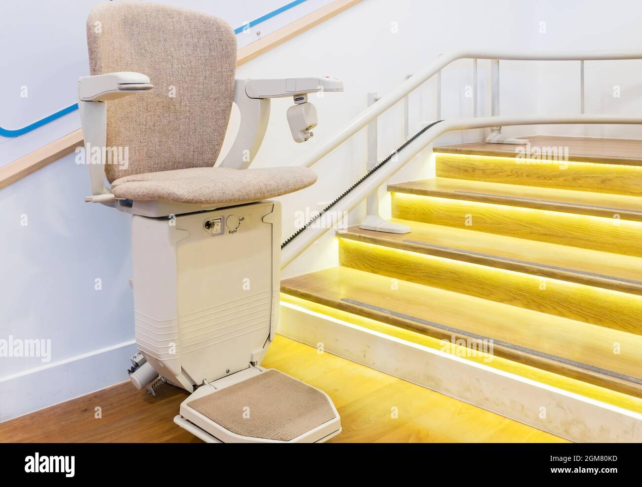 Automatic stair lift on staircase for elderly people and disabled ...