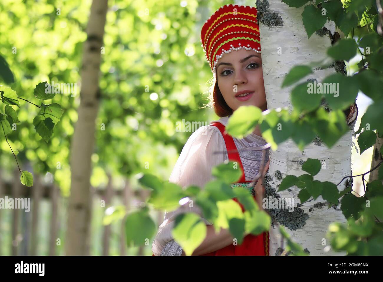 Slav in traditional dress hiding behind trees Stock Photo - Alamy