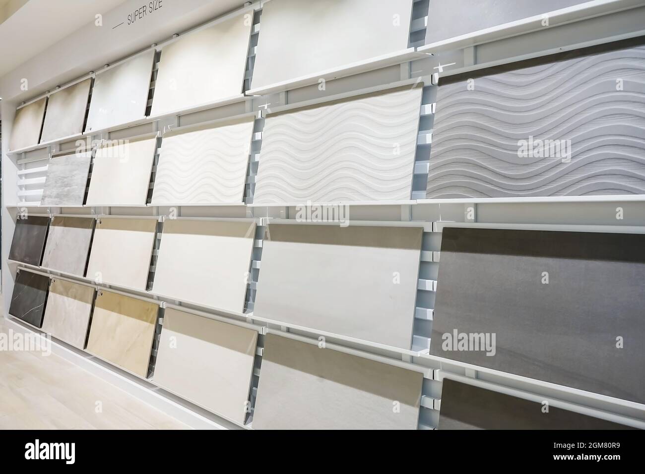 Colorful samples of a stone tile in store. Marble and granite flooring ...