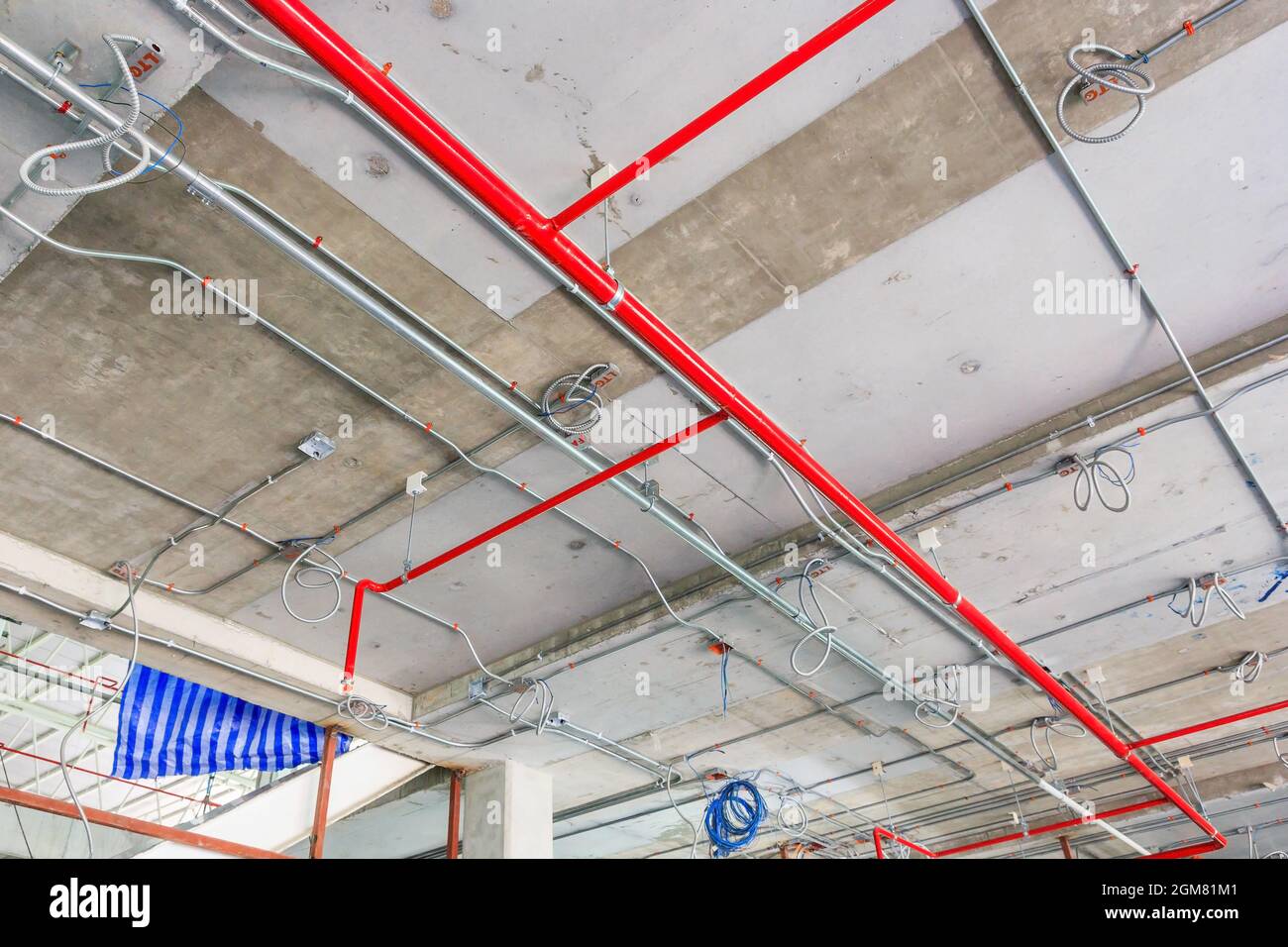 Ventilation pipes in silver insulation material and fire sprinkler on ...