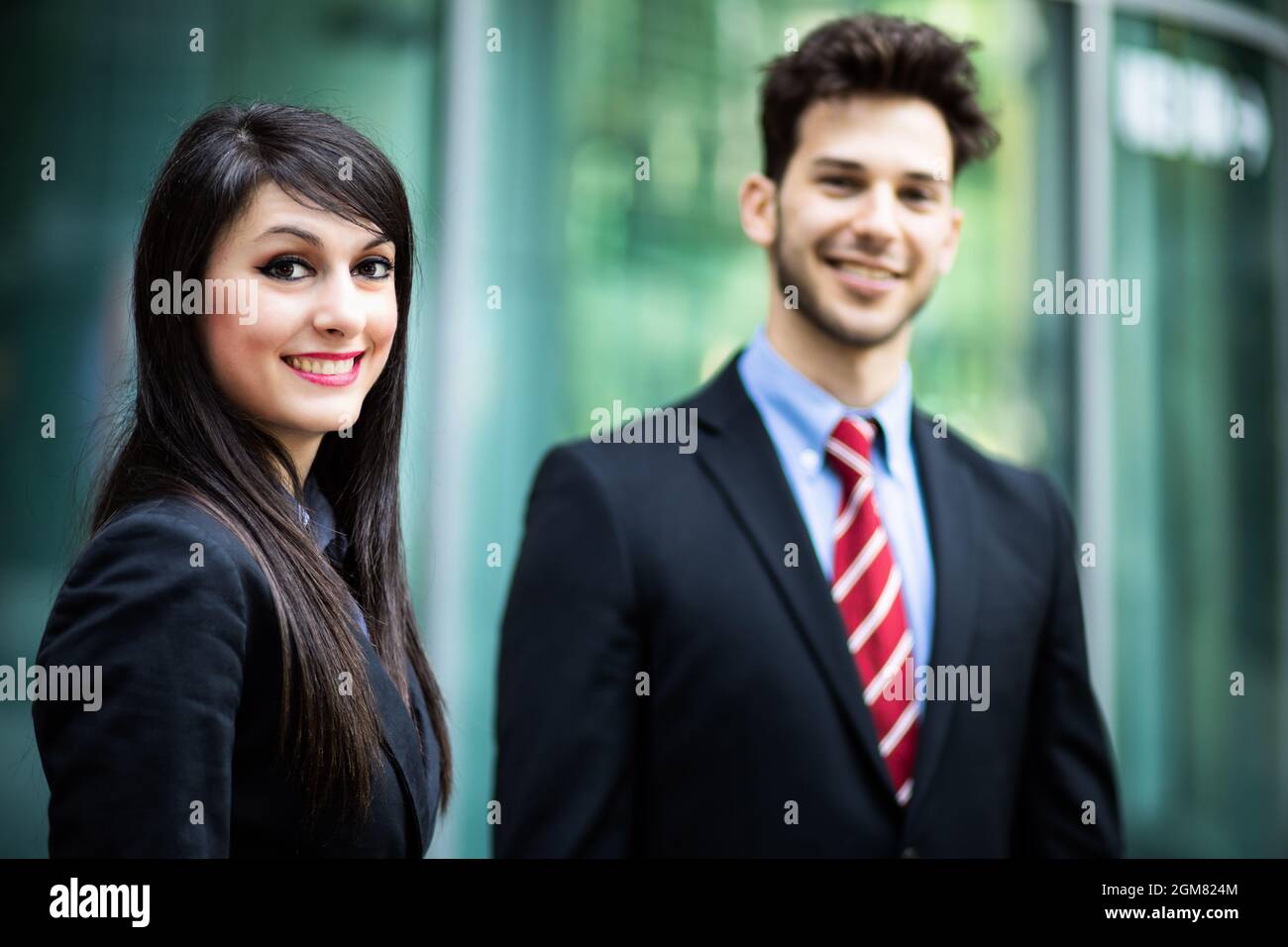 Business partners outdoor smiling confidently Stock Photo - Alamy