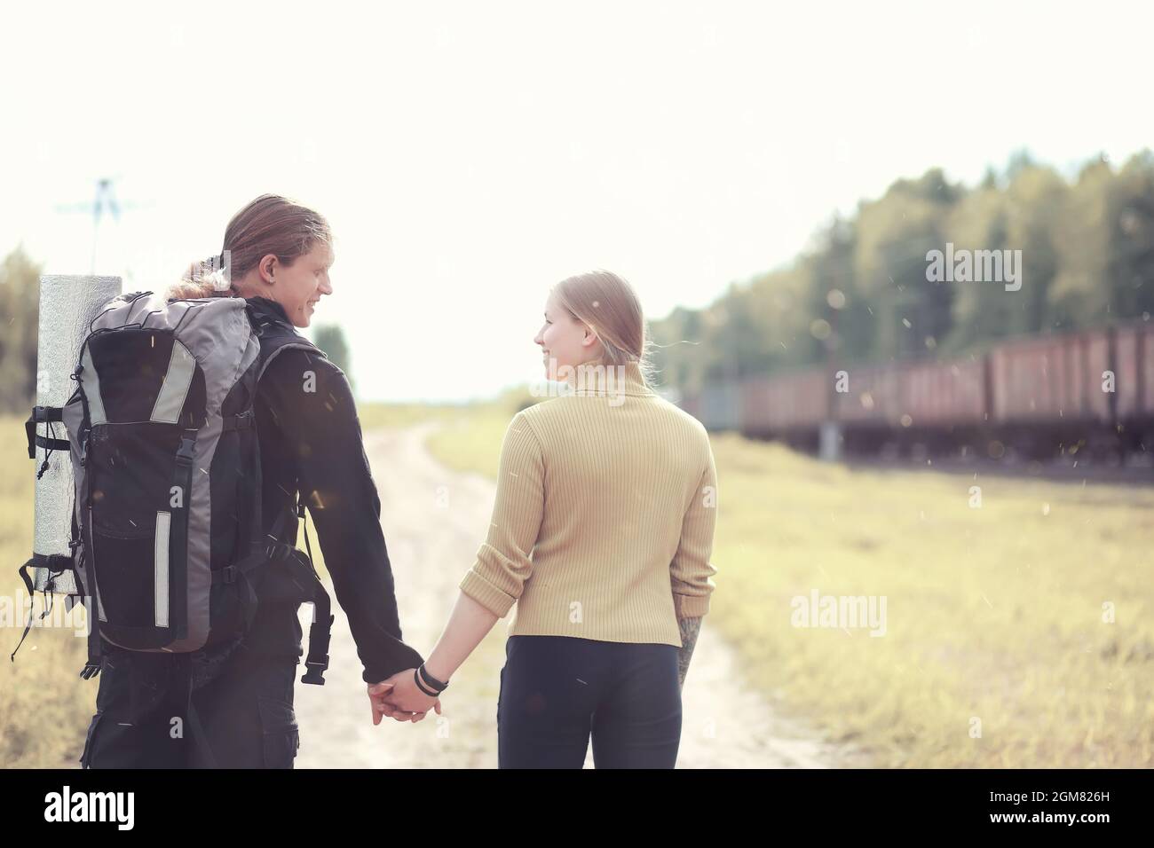 Traveling with a backpack on foot and hitchhiking Stock Photo - Alamy