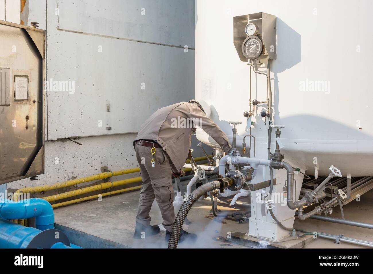 Worker loading liquid nitrogen with Nitrogen storage tank at new ...