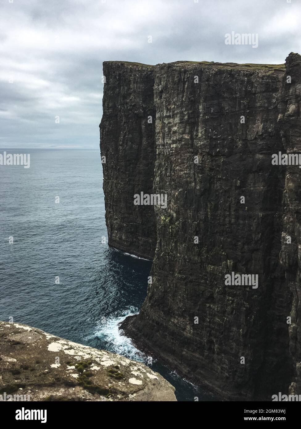 Black cliffs formation in the Atlantic ocean, Faroe Islands Stock Photo ...