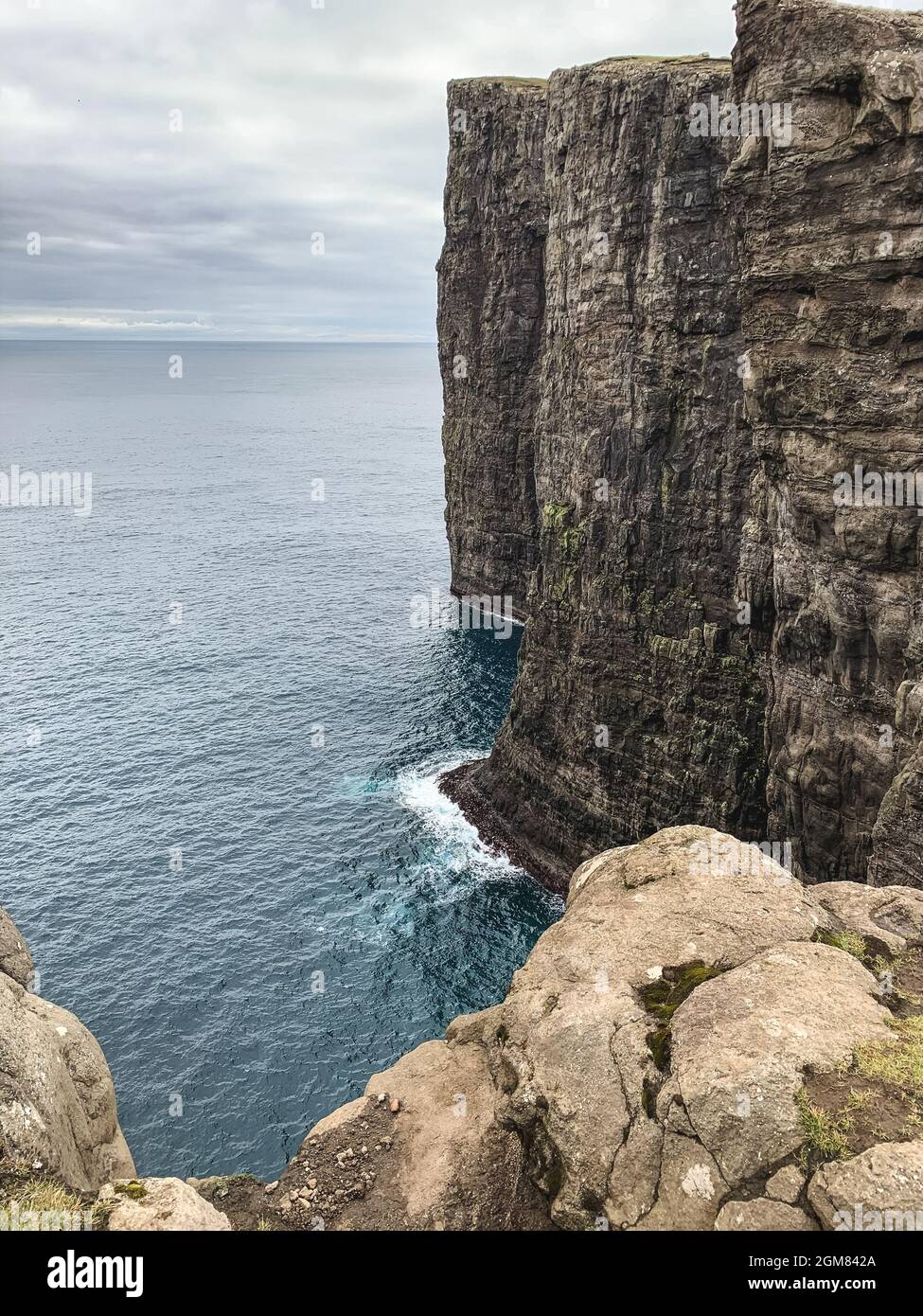 Black cliffs formation in the Atlantic ocean, Faroe Islands Stock Photo ...