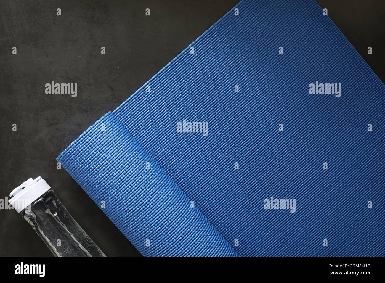 Mat for practicing yoga on a floor. Healthy lifestyle Stock Photo - Alamy
