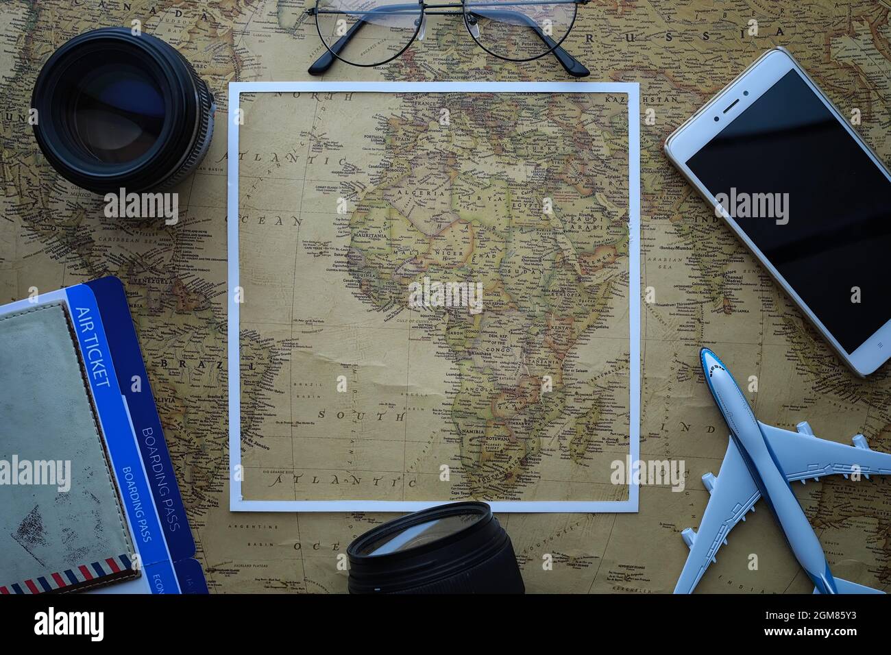 Travel concept. Map on the table and model aircraft Stock Photo - Alamy