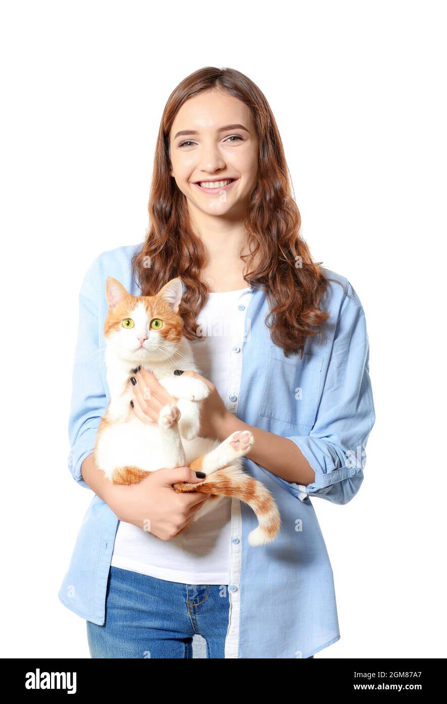 Beautiful young woman with cute cat on white background Stock Photo - Alamy
