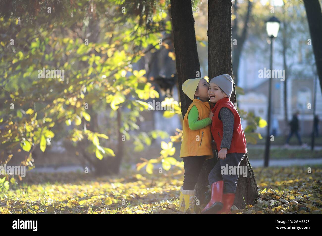 Children walk in the autumn park in the fall Stock Photo - Alamy