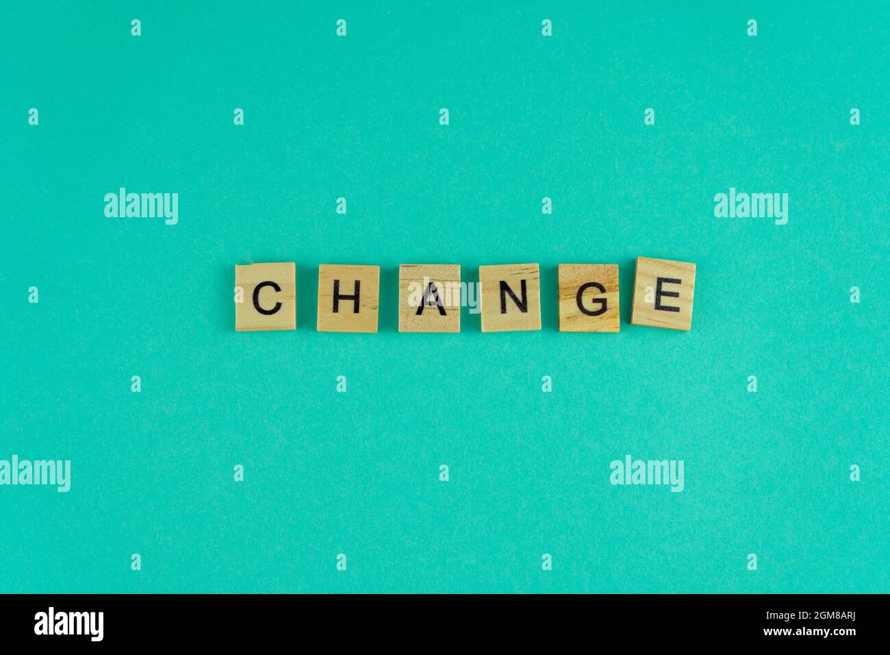 Word change. The phrase is laid out in wooden letters. Top view ...