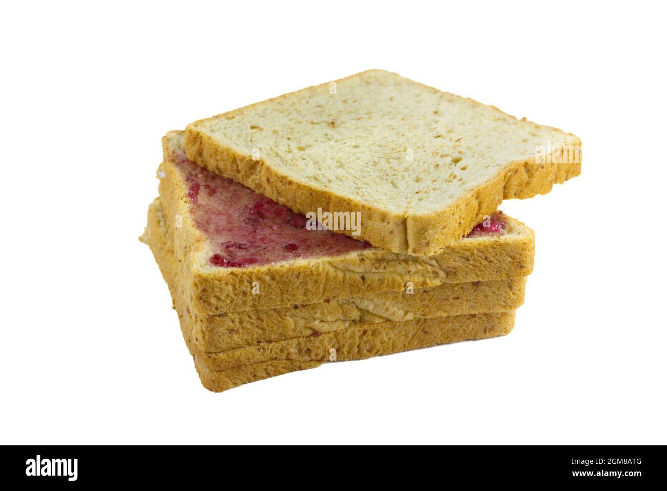 Whole wheat bread stack with grape jam on isolated white background ...