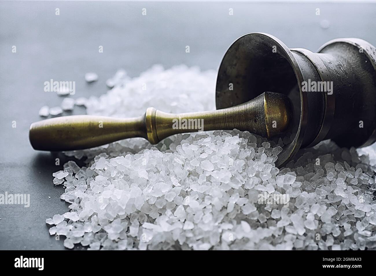 Large sea salt. Spice. Mortar and pestle for grinding salt Stock Photo ...