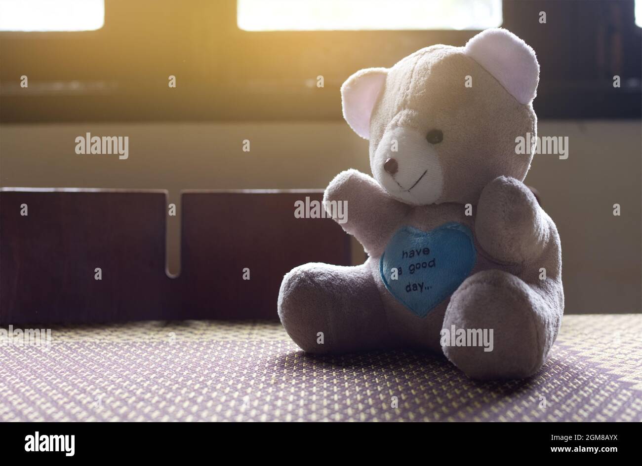 Alone teddy bear sitting on table, Sad concept Stock Photo - Alamy