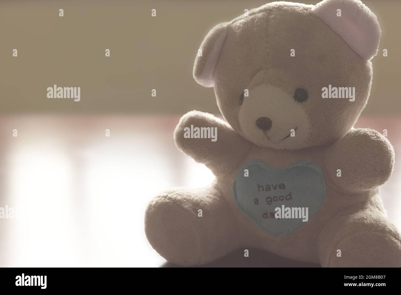 Alone teddy bear sitting on wood table, Sad concept Stock Photo - Alamy