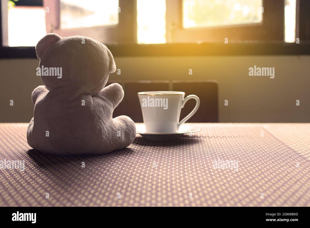 Alone teddy bear sitting on table, Sad concept Stock Photo - Alamy