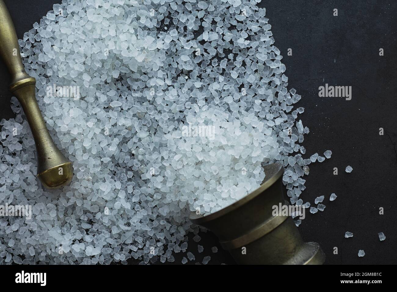 Large sea salt. Spice. Mortar and pestle for grinding salt Stock Photo ...