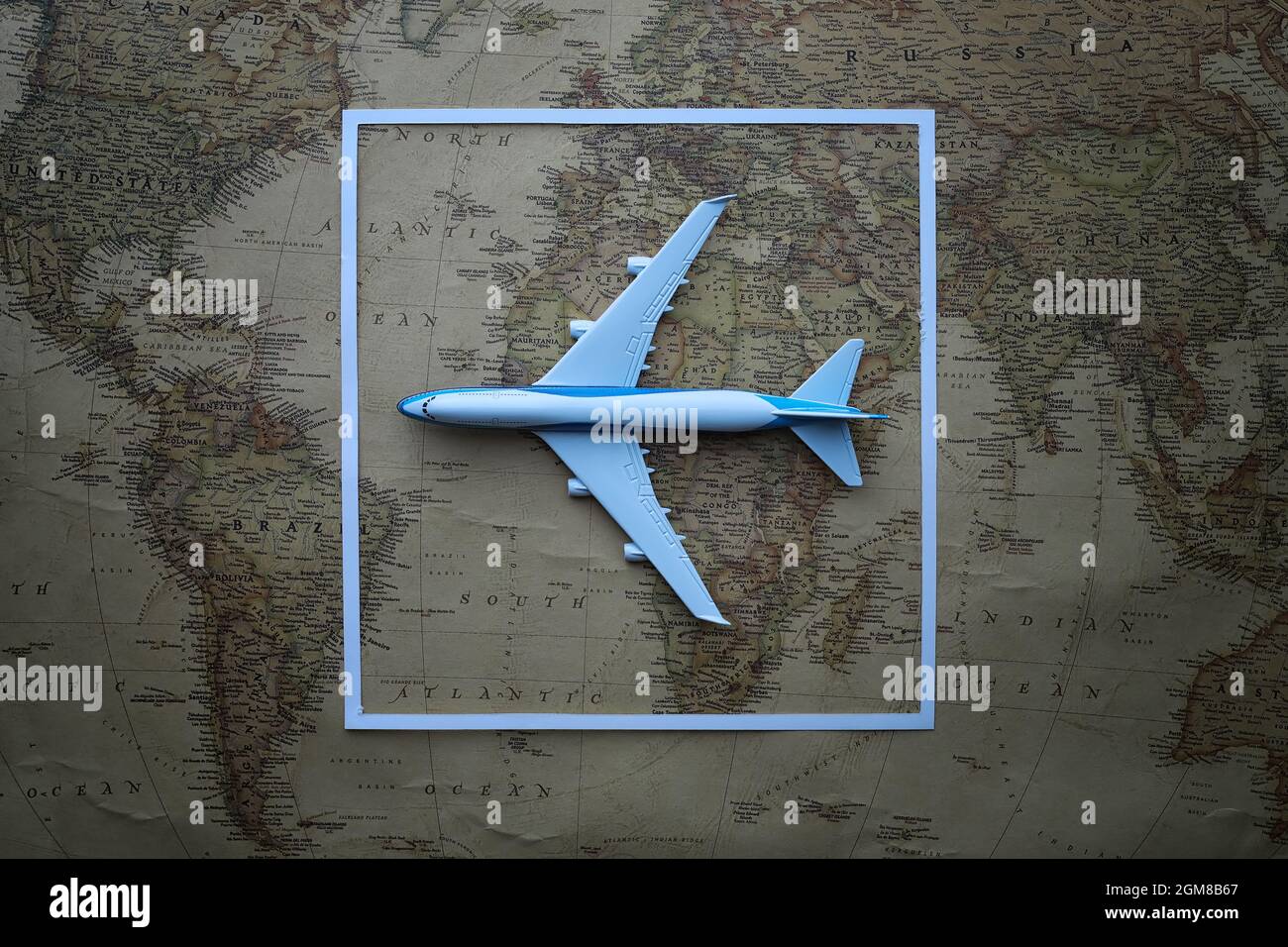 Travel concept. Map on the table and model aircraft Stock Photo - Alamy