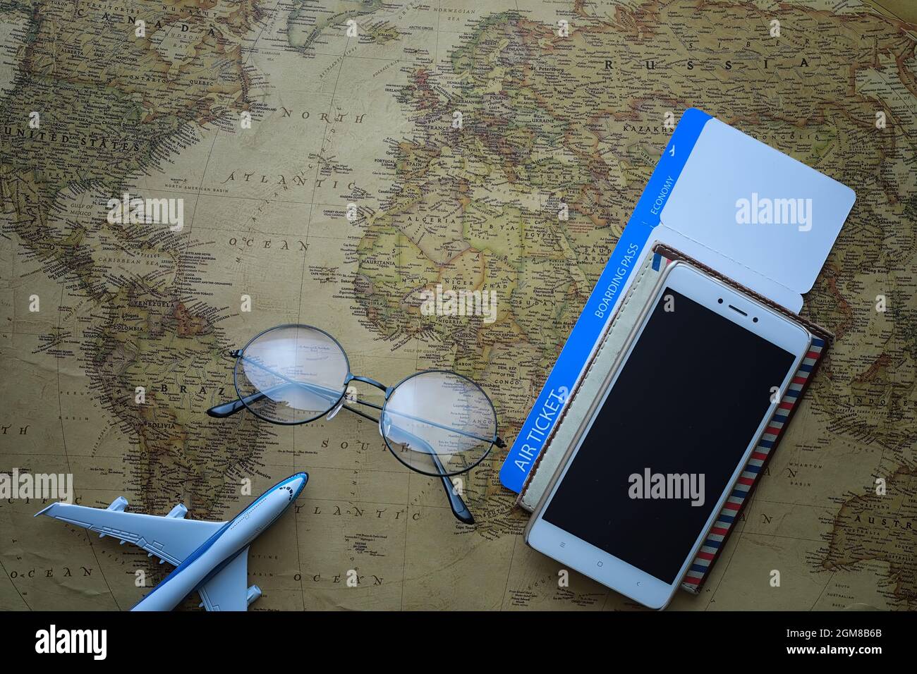 Travel concept. Map on the table and model aircraft Stock Photo - Alamy