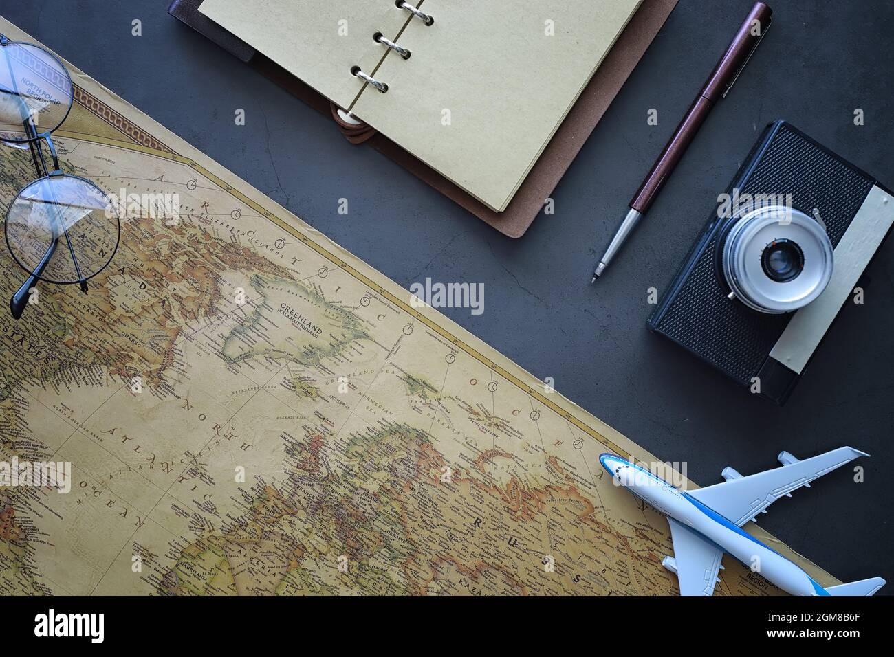 Travel concept. Map on the table and model aircraft Stock Photo - Alamy