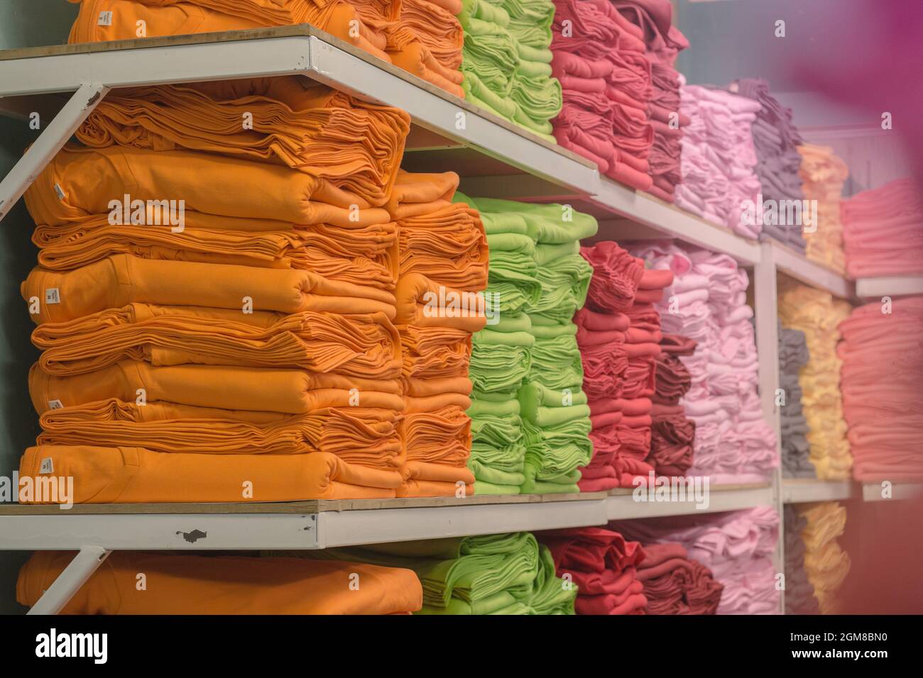 Folded clothes on shelf hi-res stock photography and images - Alamy