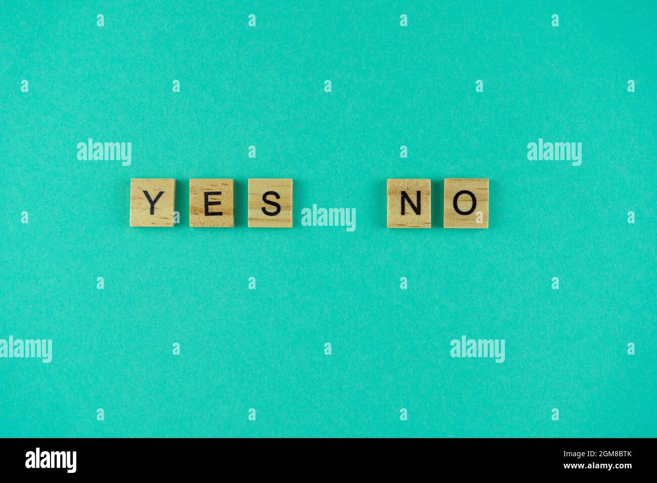 Word YES and NO. The phrase is laid out in wooden letters. Top view ...