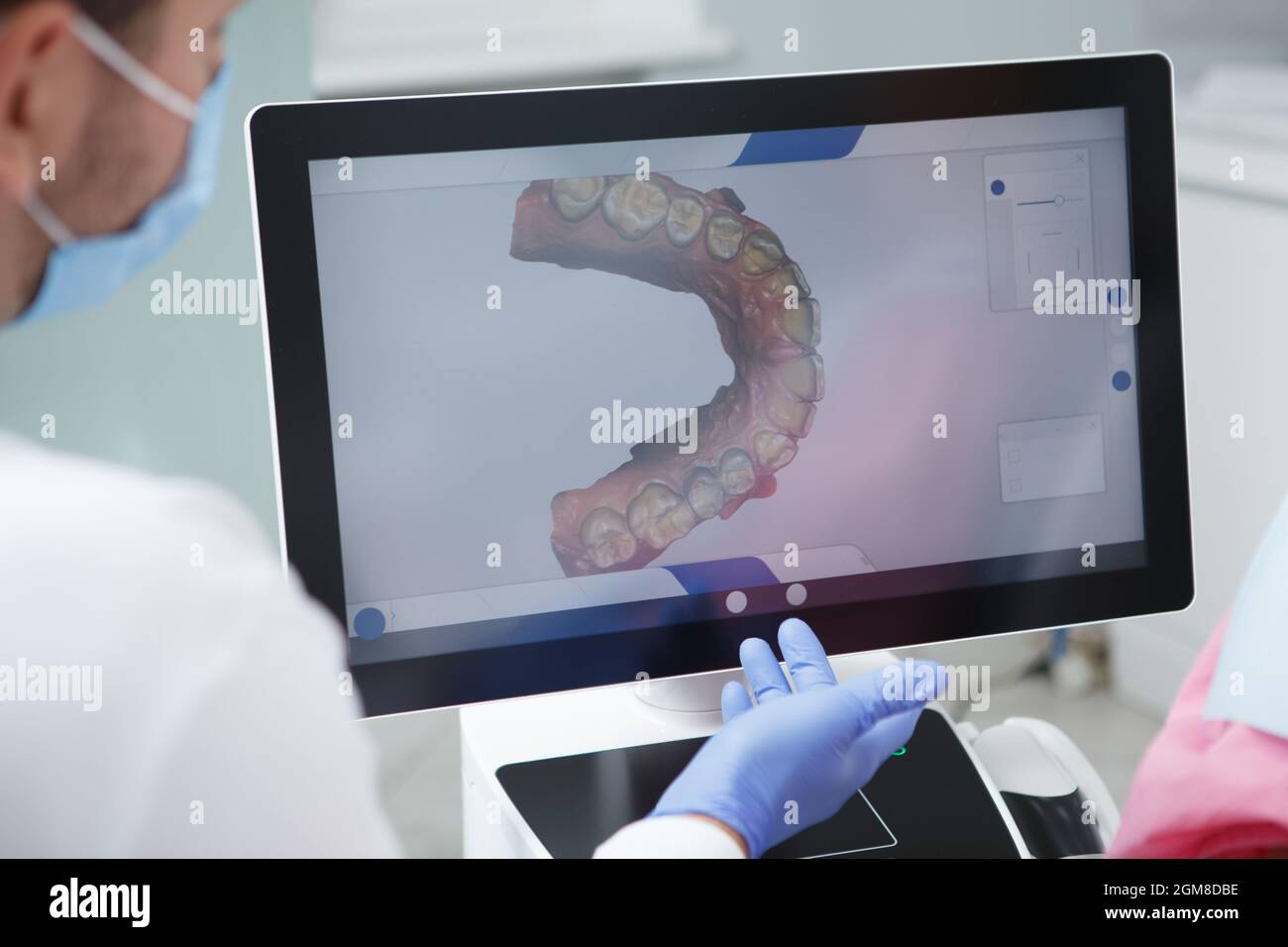 Dentist examining a 3d teeth image hi-res stock photography and images ...
