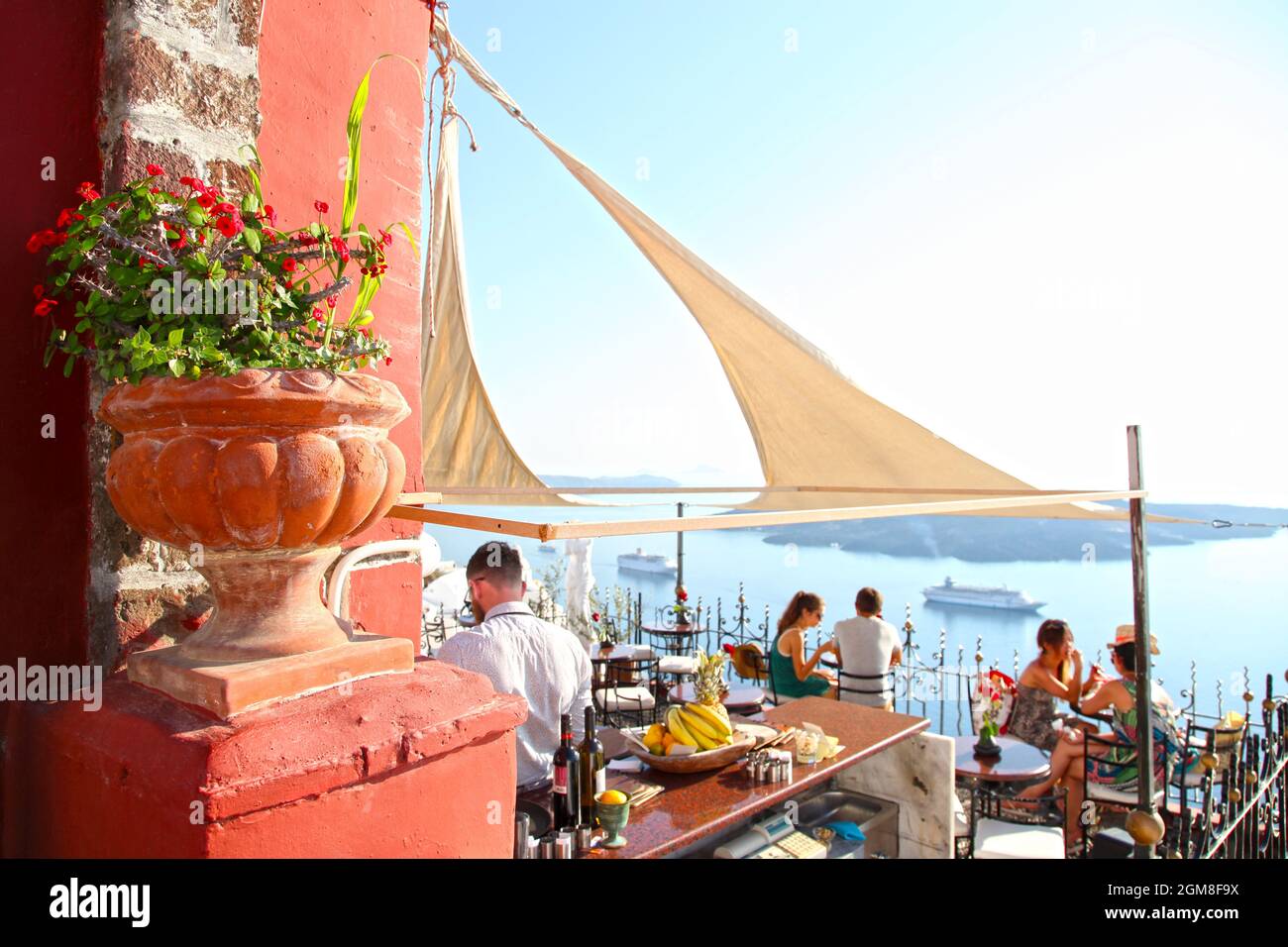 A view of the sea from PK Cocktail Bar with people in Fira, Santorini ...