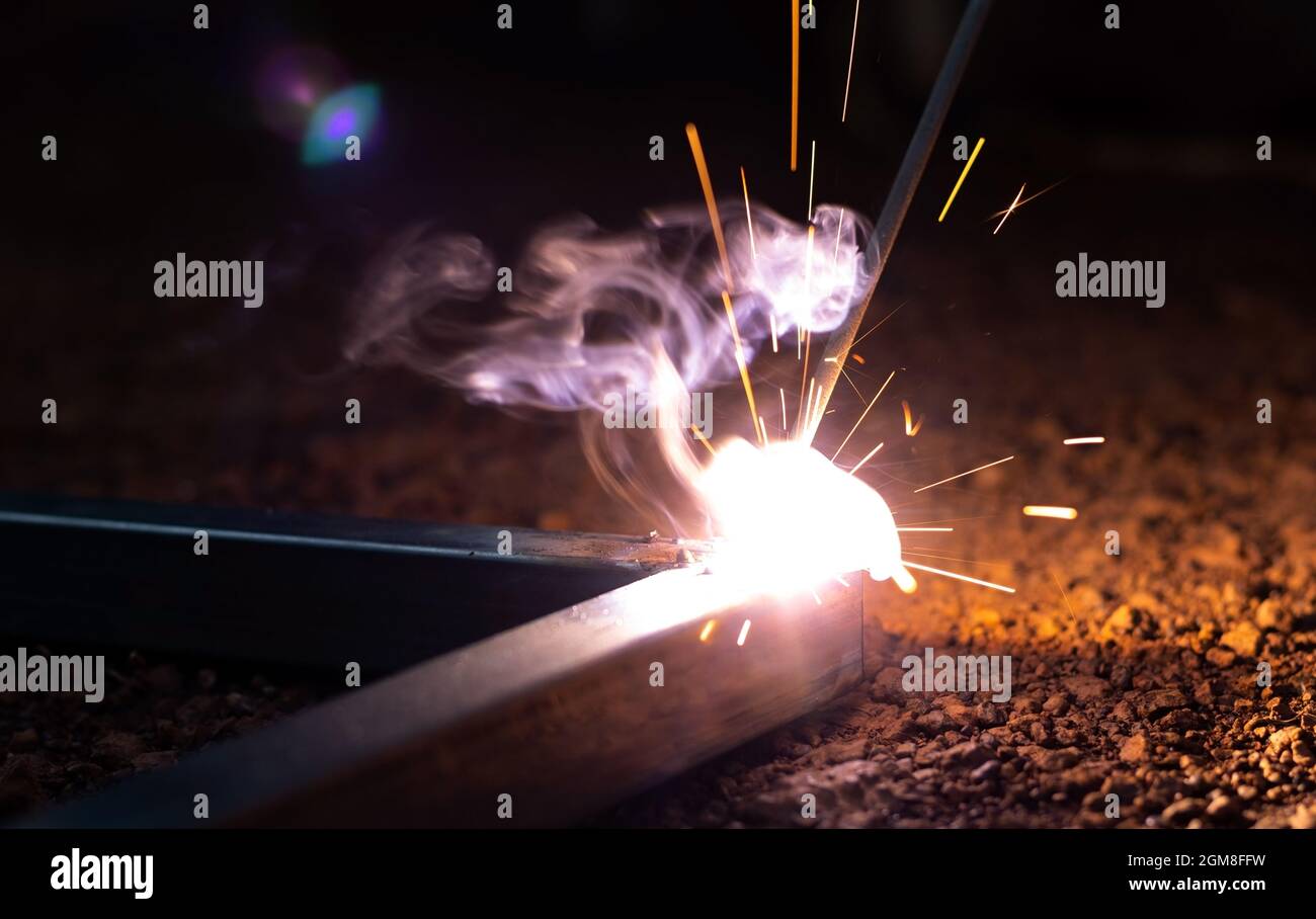 Technician focus on welding process on spark light with equipment Stock ...