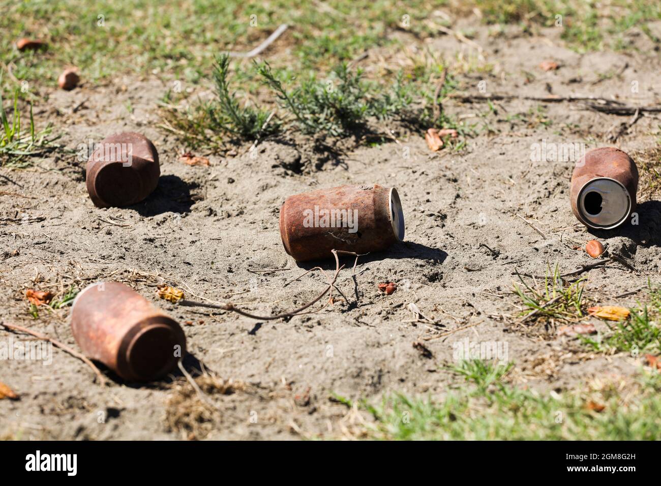 Travelers or tourists dropped cans, very rusty like polluted trash on ...