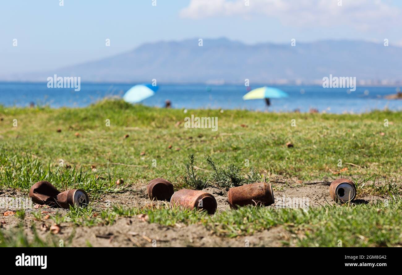 Travelers or tourists dropped cans, very rusty like polluted trash on ...