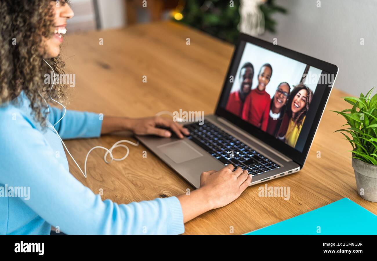 Happy African family doing video call using laptop at home - Technology ...