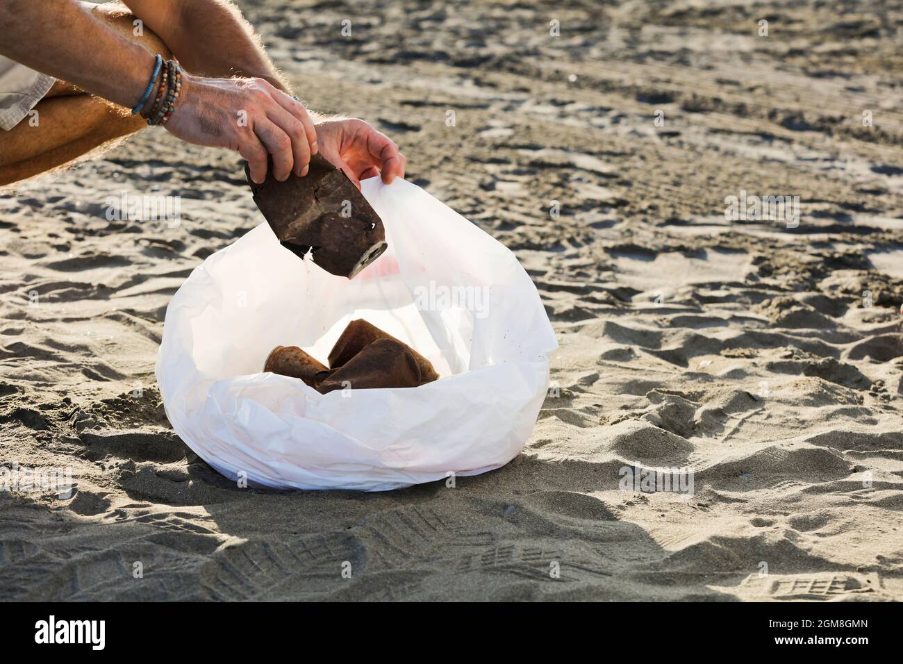 Hand Picking Up Trash