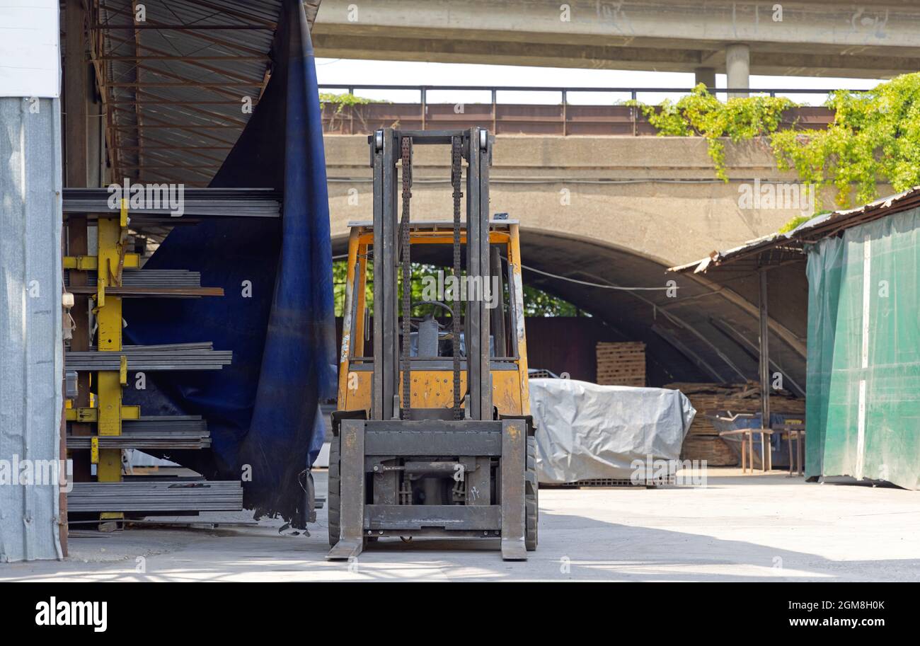 Front View of Forklift and Metal Rack With Steel Profiles Tubes Stock ...