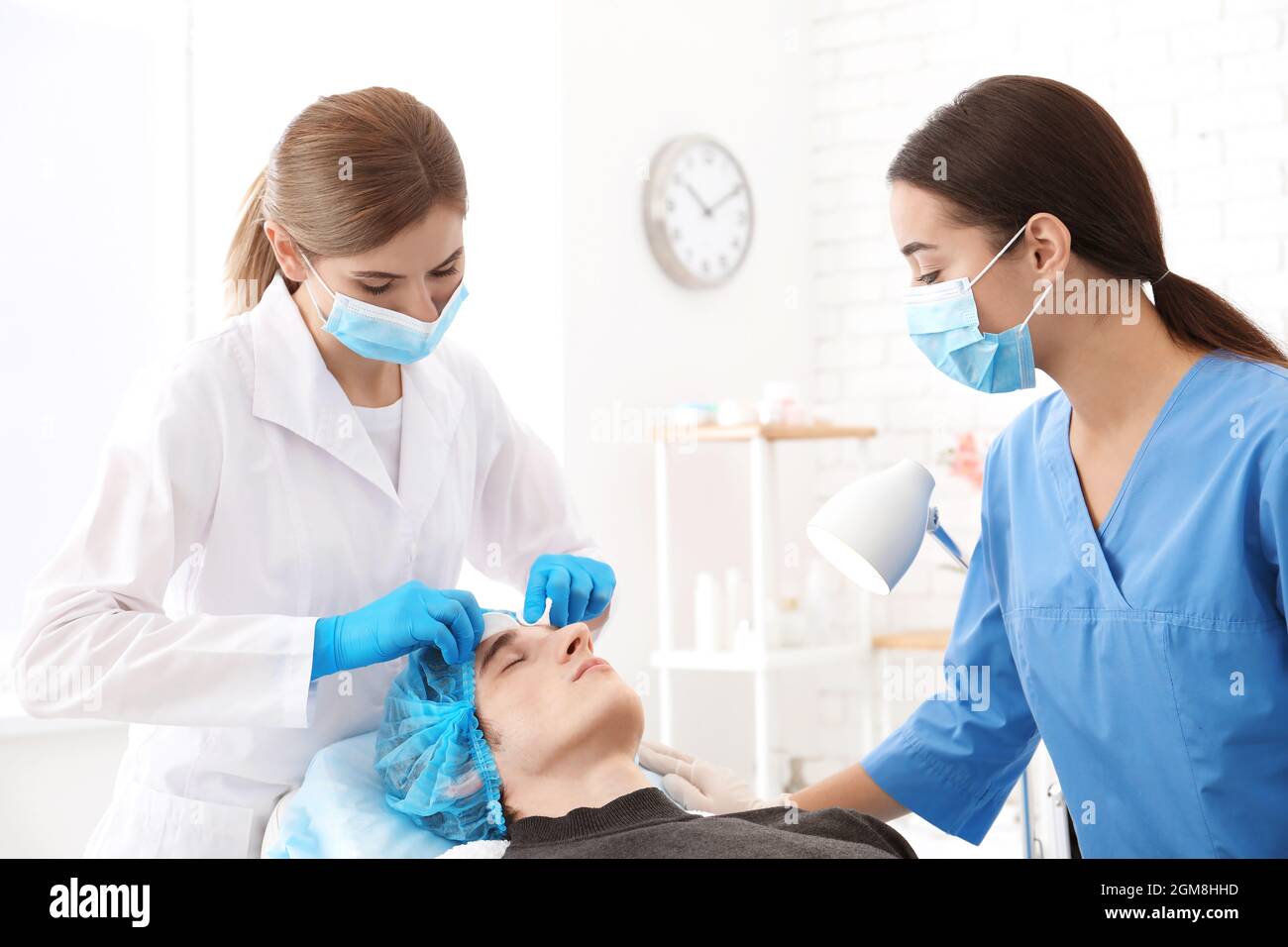 Professional beautician teaching trainee in salon. Apprenticeship ...