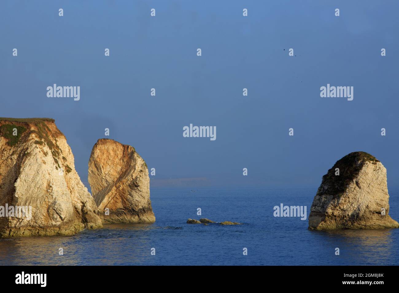 Rocks jutting put of the sea in Freshwater Bay, Isle of Wight Stock ...