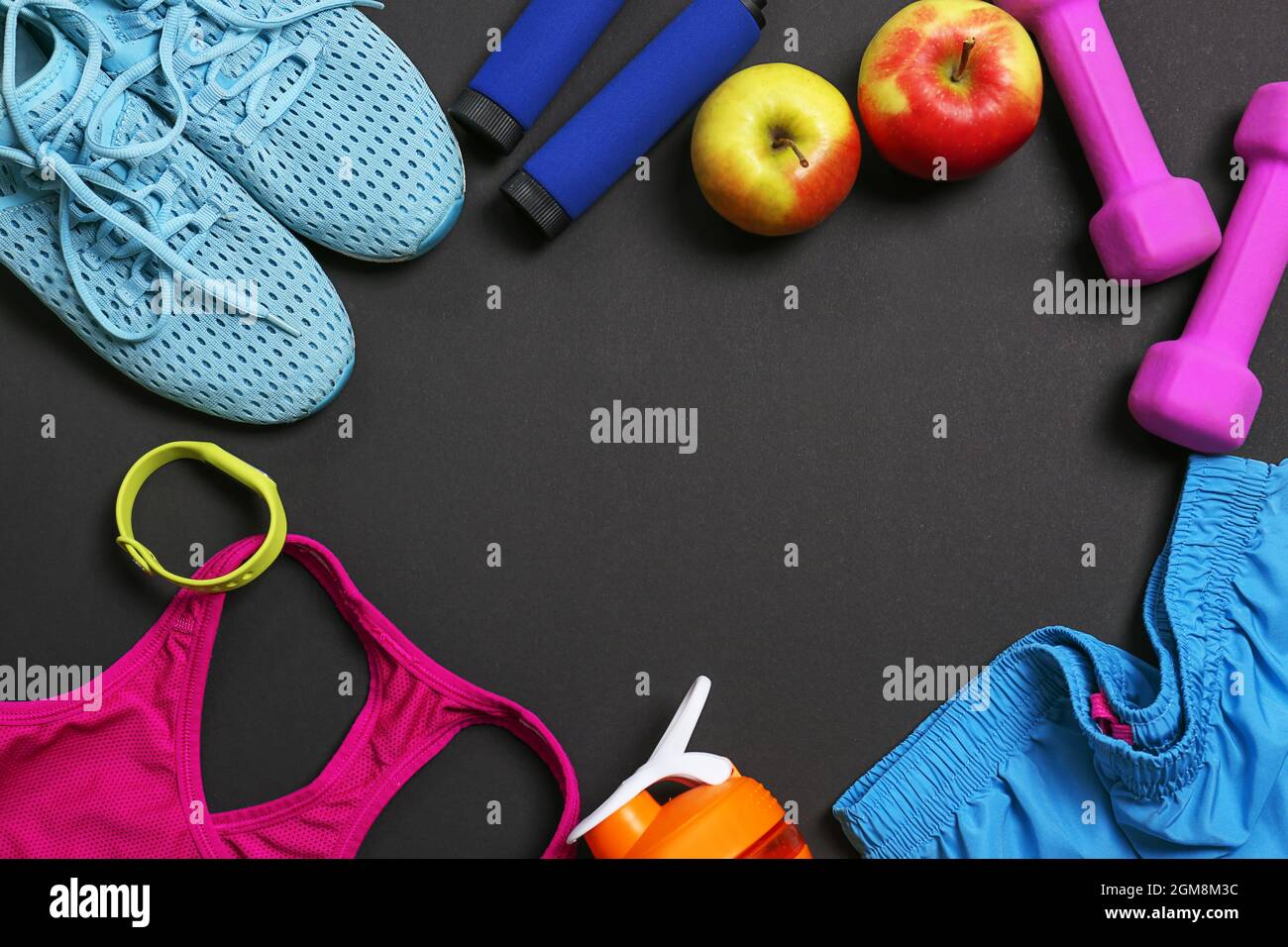 Gym stuff and blank space for exercise plan on dark background. Flat ...