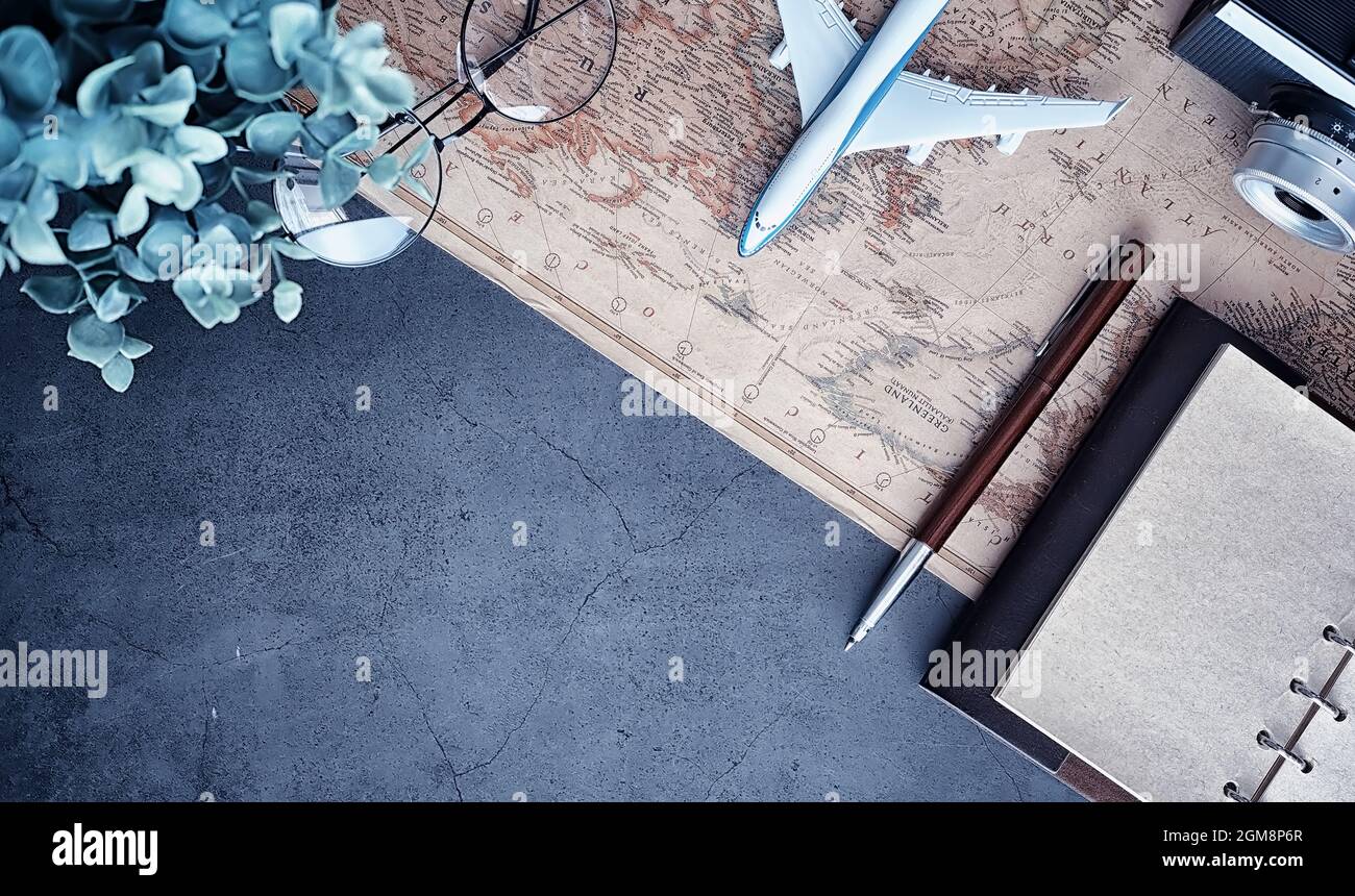 Travel concept. Map on the table and model aircraft Stock Photo - Alamy