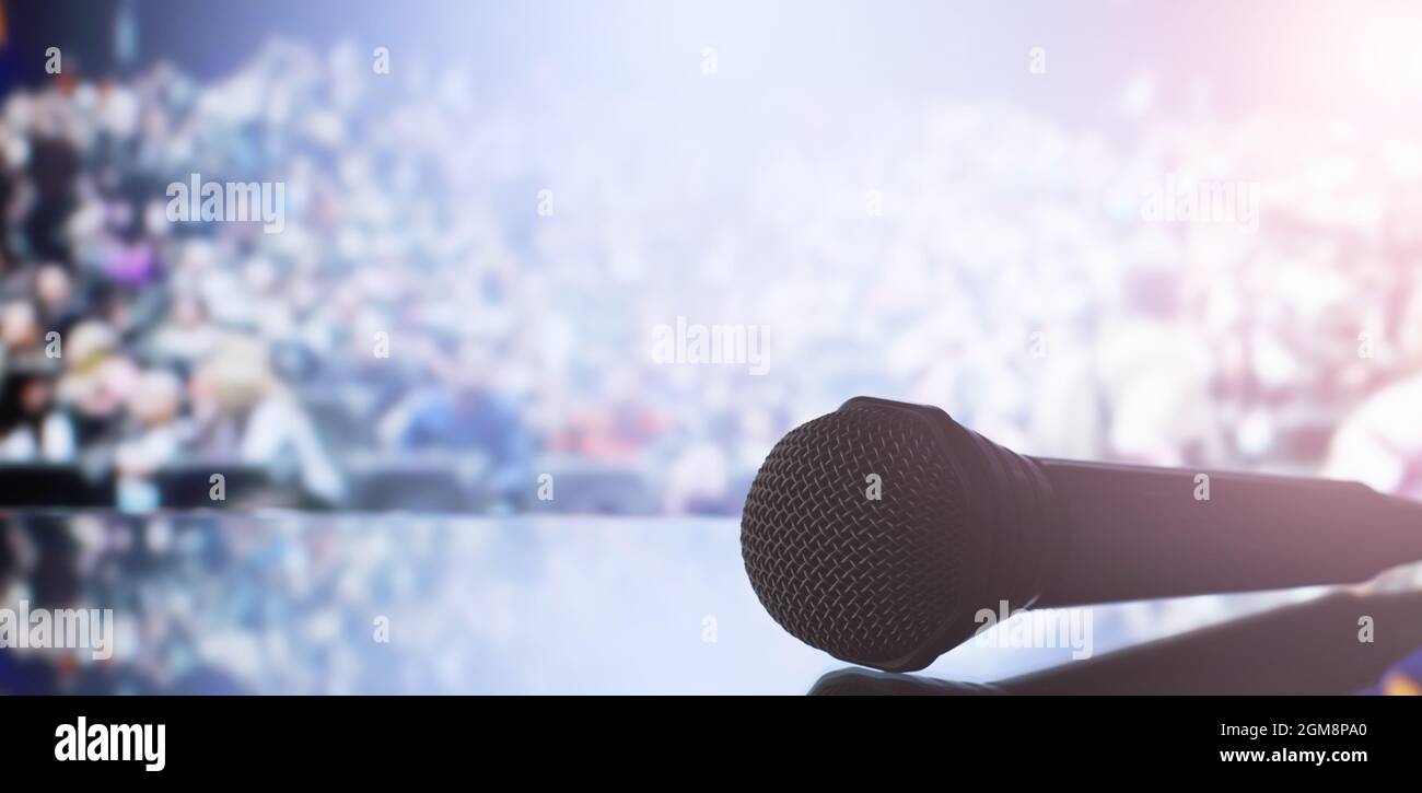 The microphone on the stage in front of the hall. Performance on stage ...