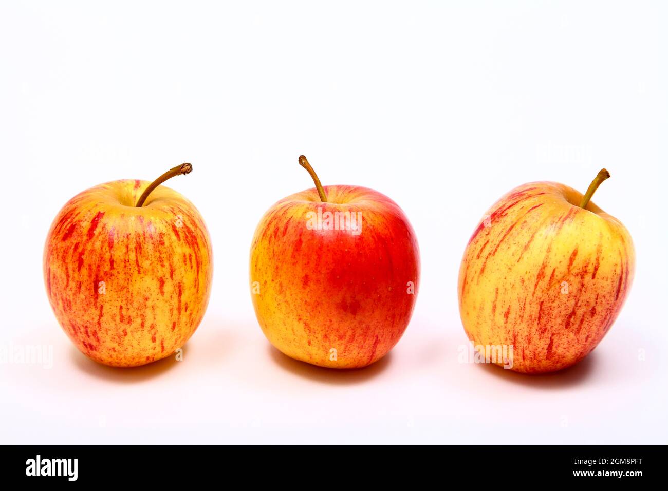 Three ripe eating apples isolated on a white background Stock Photo - Alamy