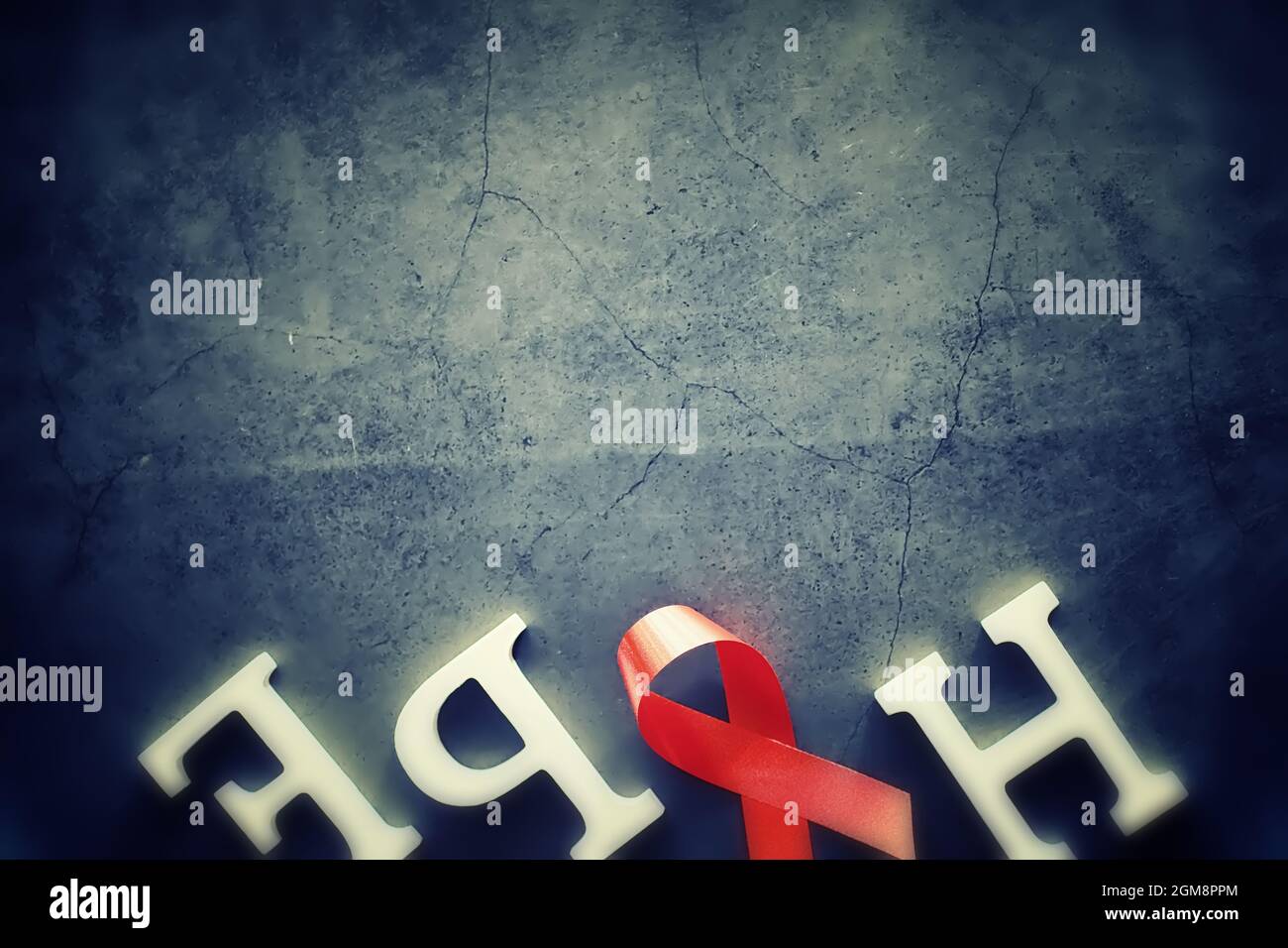 Symbol of human immunodeficiency virus disease. Red ribbon. A helping ...