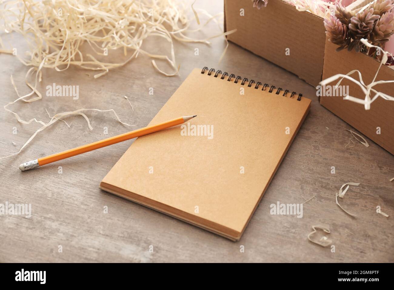 Preparing parcels for shipment to customer on table Stock Photo - Alamy