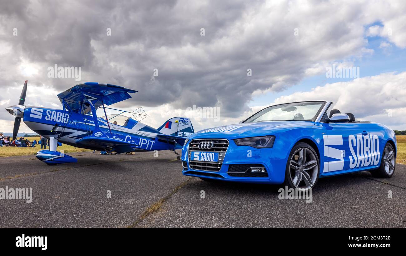 Rich Goodwin Jet Pitts Special biplane ‘G-JPIT’ alongside their convertible Audi A5 sponsored by ...