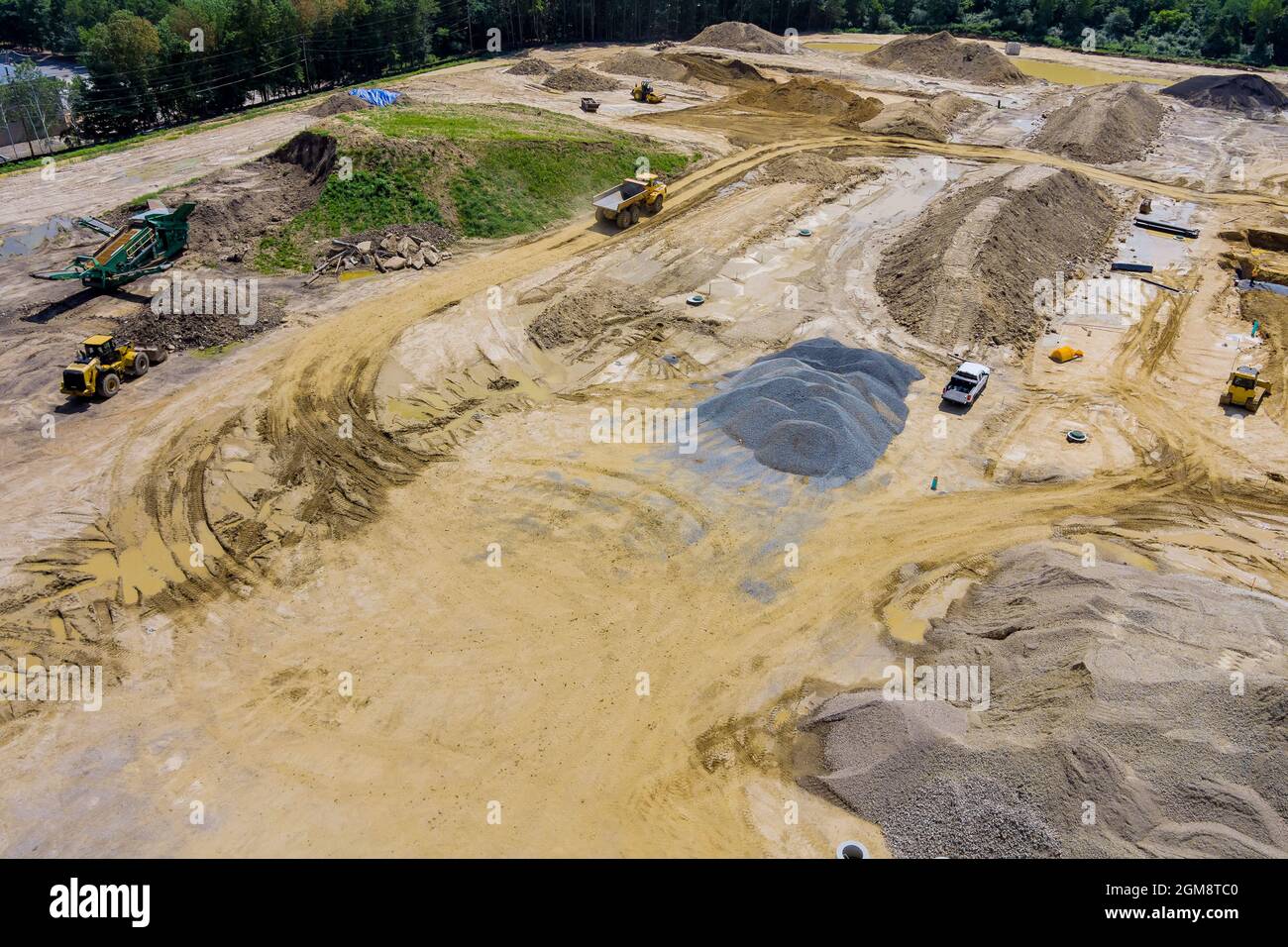 Aerial panoramic view of under construction area with construction site ...