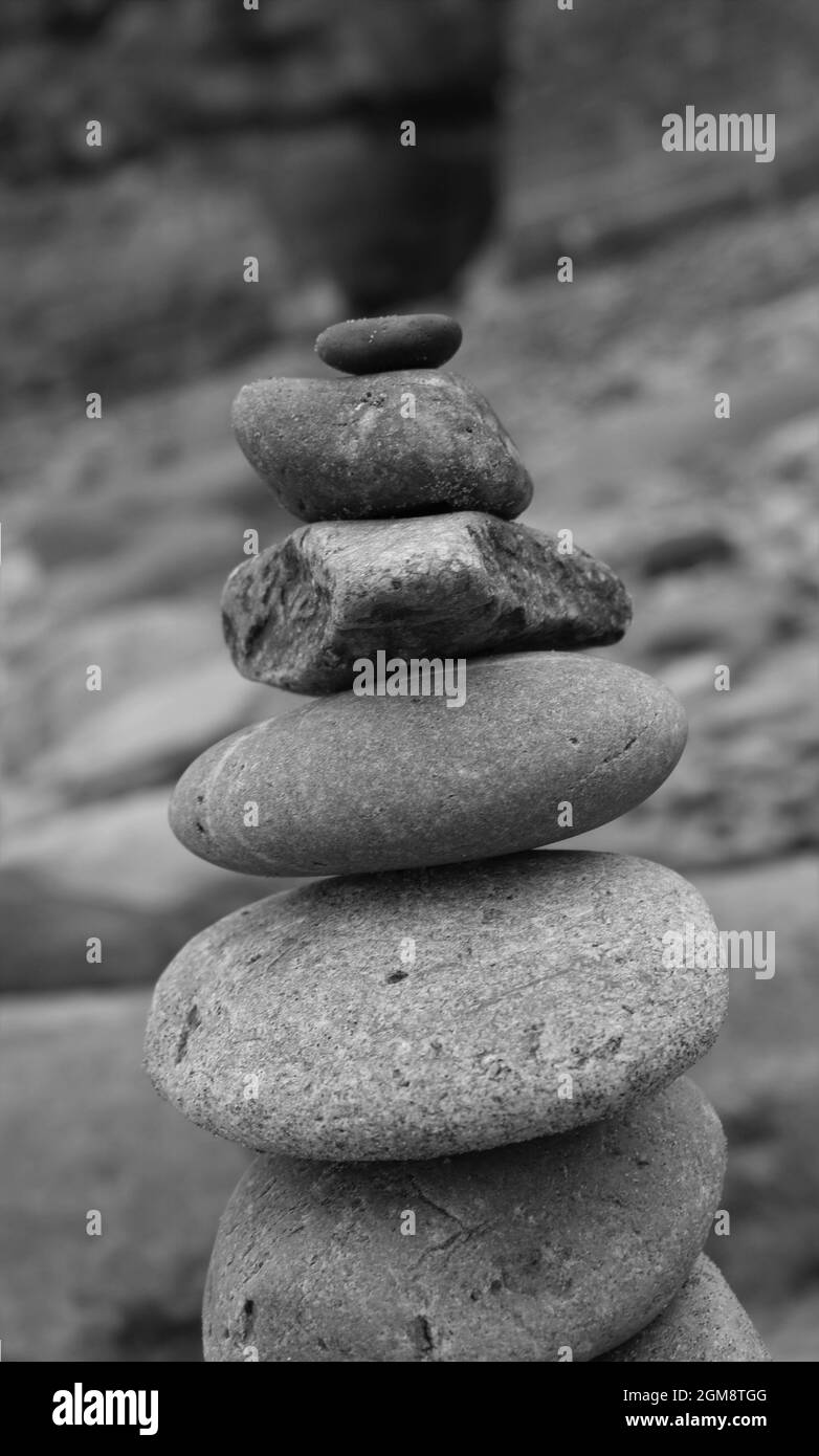 Black and white photo of stacked pebbles on a beach Stock Photo - Alamy